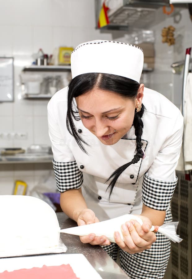 Pastry Chef Decorates a Cake Stock Image - Image of slice, woman: 37090173