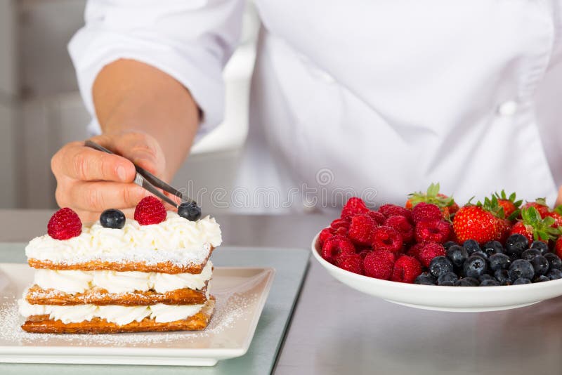 Pastry chef decorating stock image. Image of beater, kneading - 78881201