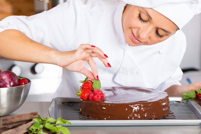 Pastry chef in the kitchen stock photo. Image of dessert - 101569160