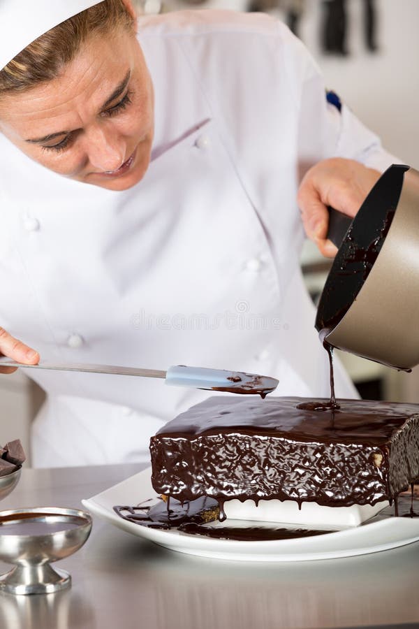 Pastry chef in the kitchen stock photo. Image of boss - 66280526