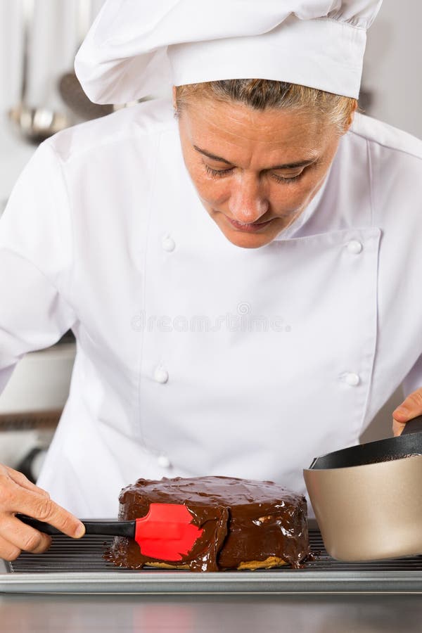 Pastry chef in the kitchen stock photo. Image of biscuit - 74424942