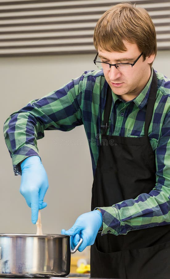 Pastry Chef Man with Glasses in the Kitchen Brews Dough Stock Photo ...