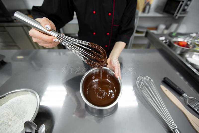 The Pastry Chef Mixes the Chocolate Ganache with a Whisk Stock Photo ...