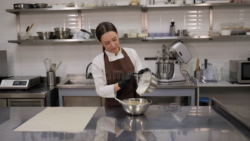 The Pastry Chef Mixes Pistachio Mousse and Whipped Milk Cream in a ...