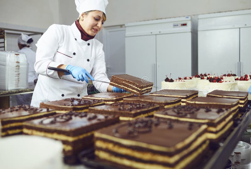 Pastry Chef Pack a Cake on a Table in the Bakery. Stock Photo - Image ...