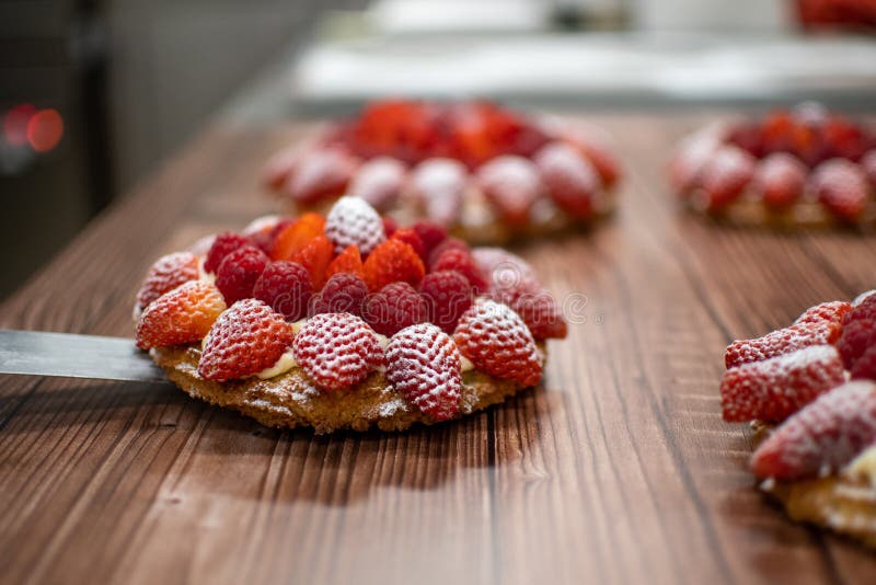 Pastry chef placing a cake stock image. Image of wood - 263172007