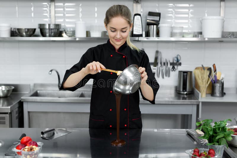 The Pastry Chef Pours Hot Chocolate on a Cold Table for Tempering Stock ...