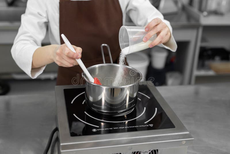 Pastry Chef Pours the Sugar into a Saucepan. Stock Image - Image of ...