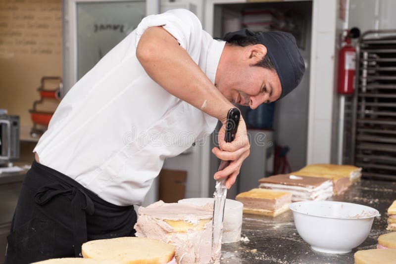 Pastry Chef Preparing and Baking Stack of Chocolate Crust for Salty ...