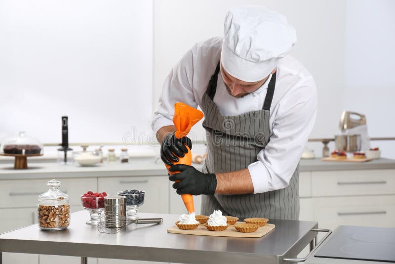 Pastry Chef Preparing Desserts at Table Stock Photo - Image of ...