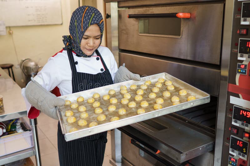 Pastry Chef Put a Dough into the Oven Stock Photo - Image of cooking ...