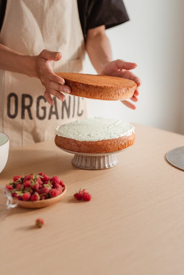 Pastry Chef Puts Cake Layer on a Cake. Making Cake Process Stock Image ...