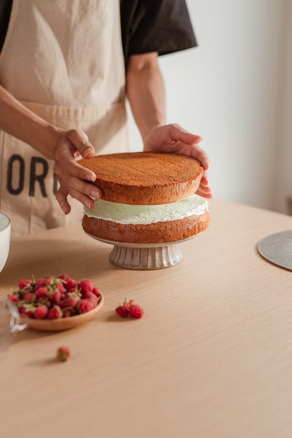 Pastry Chef Puts Cake Layer on a Cake. Making Cake Process Stock Image ...
