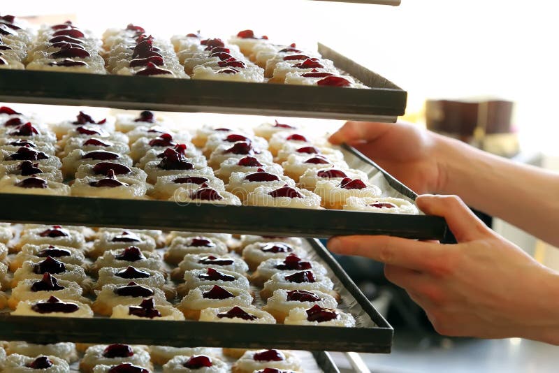 Pastry Chef Puts Cakes in the Bakery Stock Photo - Image of ...