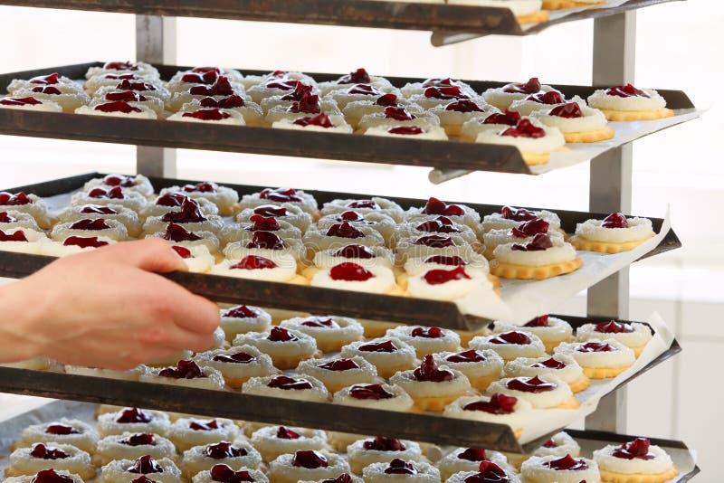 Pastry Chef Puts Cakes in the Bakery Stock Photo - Image of food, baker ...