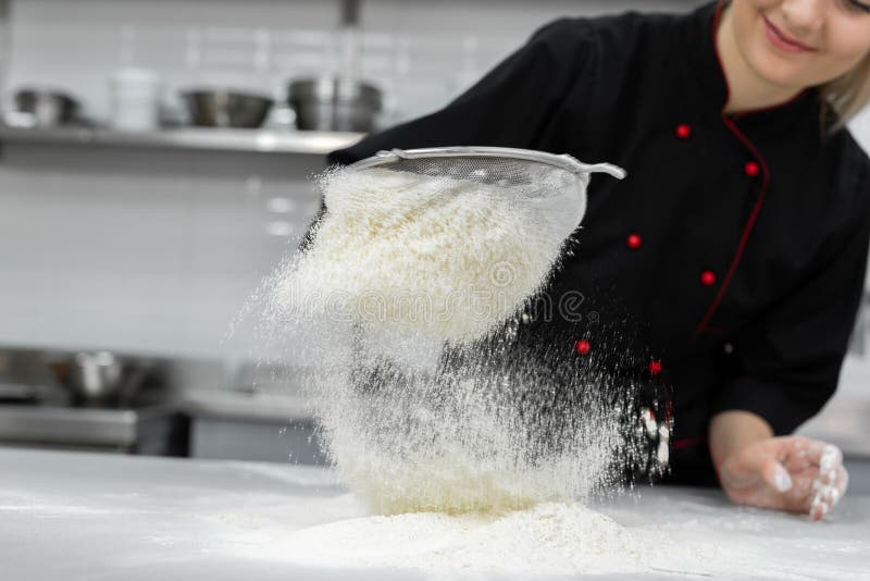 The Pastry Chef S Hands Sift the Flour through a Sieve on the Table ...