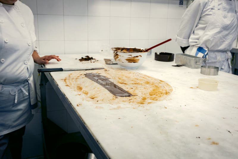 Pastry Chef Tempering Chocolate in a Professional Bakery Stock Photo ...