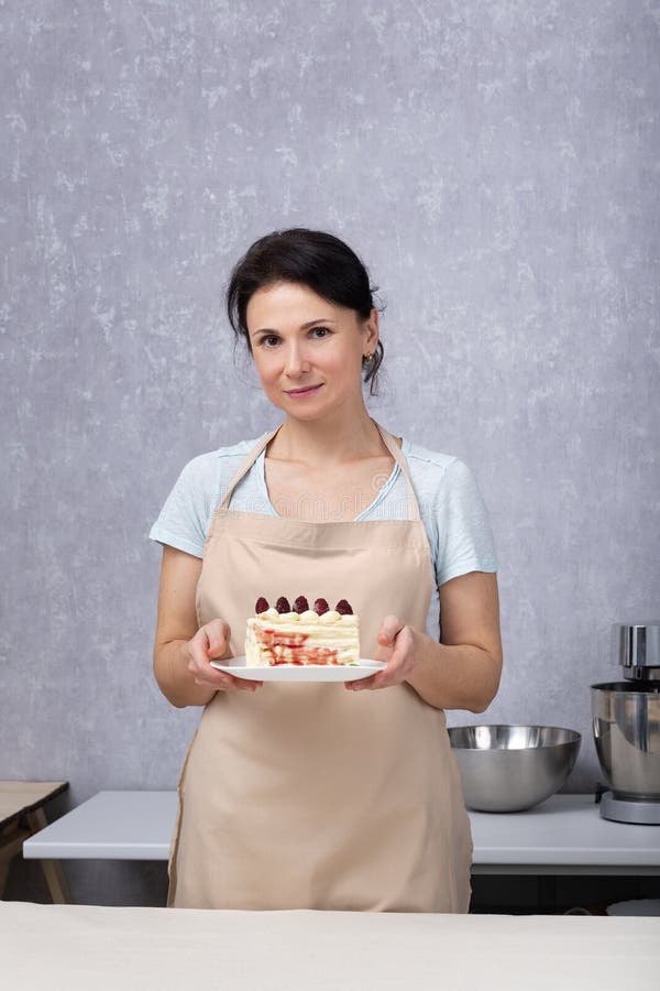 Pastry Chef Woman Holds a Cake with Berries. Vertical Frame Stock Image ...