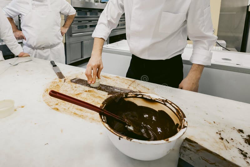 Pastry Chef Tempering Chocolate in a Professional Bakery Stock Photo ...
