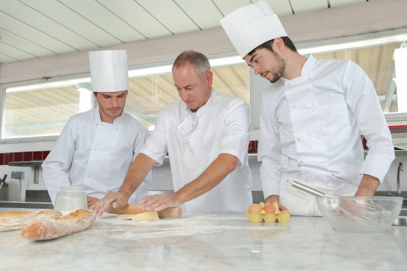 Pastry trainees at work stock photo. Image of teacher - 260650654