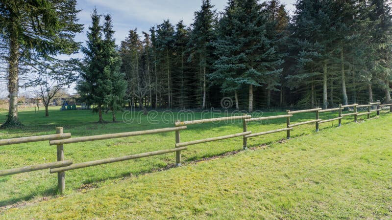 A Pasture with Fence and Trees Stock Photo - Image of blue, outdoor ...