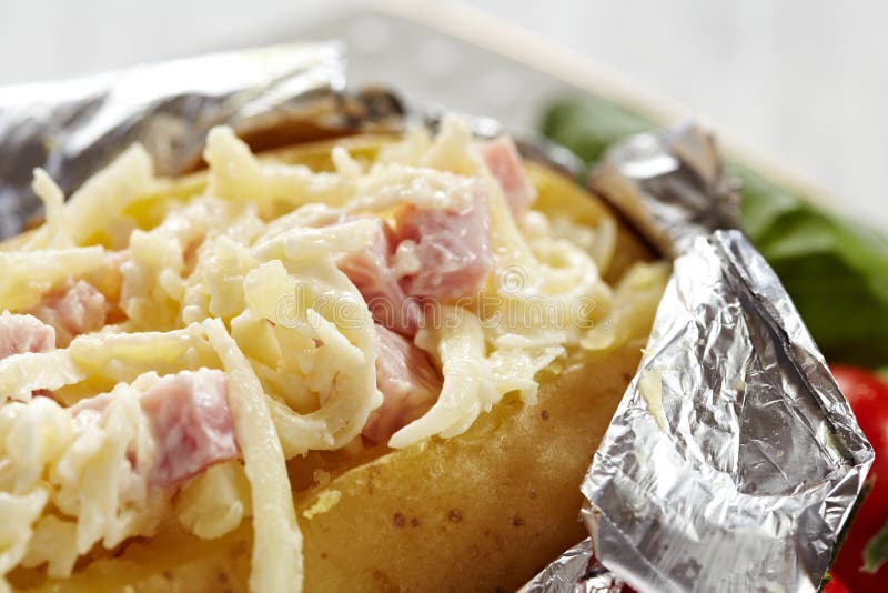 Patata cocida al horno imagen de archivo. Imagen de revuelto - 24938587