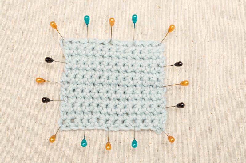 Patch of Light Blue Crocheted Fabric Fastened with Pins Stock Photo ...