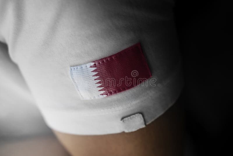 Patch of the National Flag of the Qatar on a White T-shirt Stock Image ...