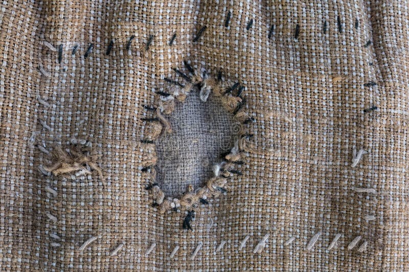Patch on Torn Coarse Sackcloth Roughly Sewn within, Close-up Stock ...