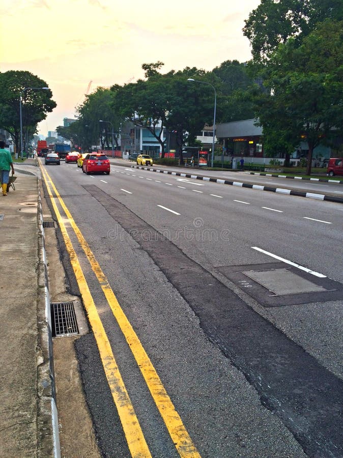 Patching the Road. Workers in Uniform Lay Asphalt from a Truck ...
