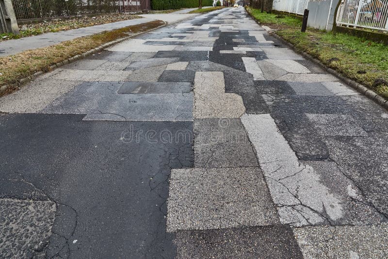 Patched broken road stock photo. Image of asphalt, crack - 257994758