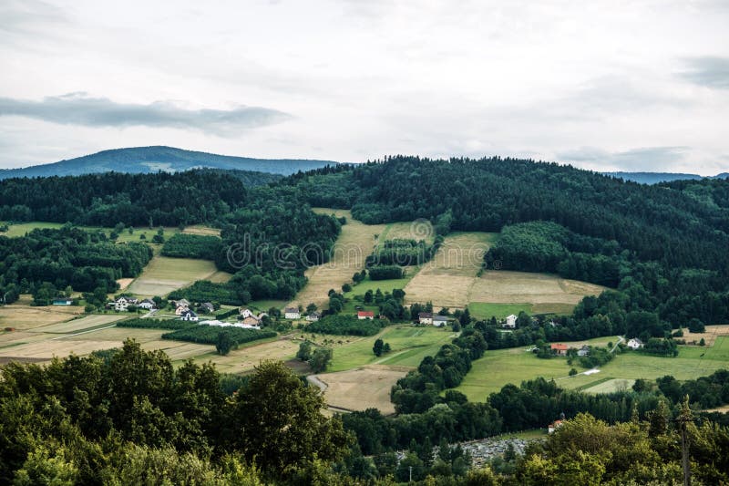 Patchwork of Fields and Small Farms Nestled at the Foot of a Forested ...