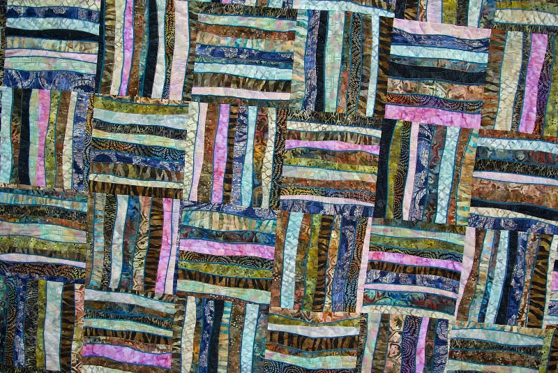 A Patchwork Quilt with Many Different Colored Squares Stock Image ...