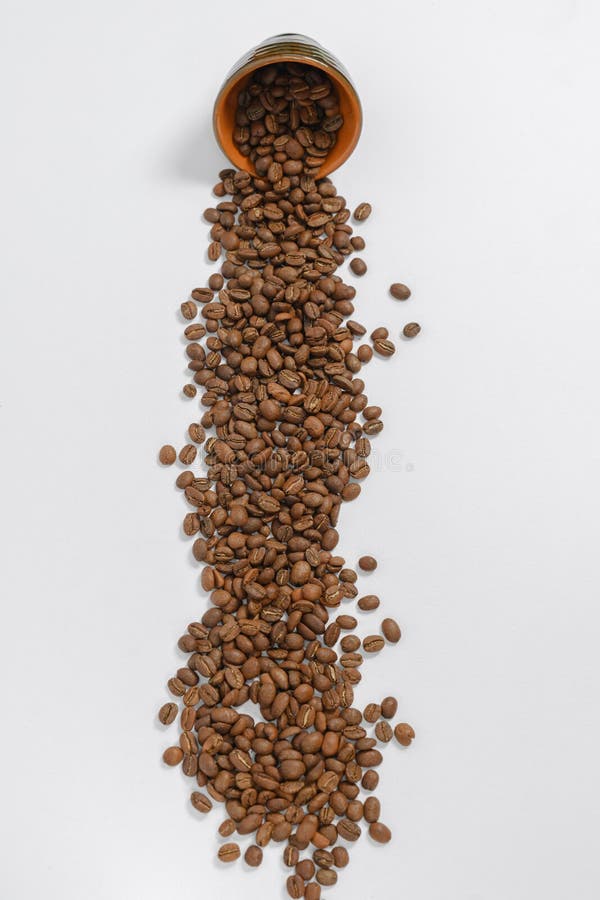 Path of Coffee Beans Spilled from a Mug, Coffee on an Isolated White ...