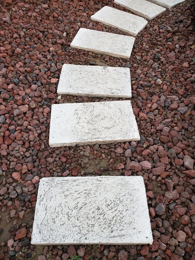 Path with Concrete Blocks between Small Red Stones Stock Photo - Image ...