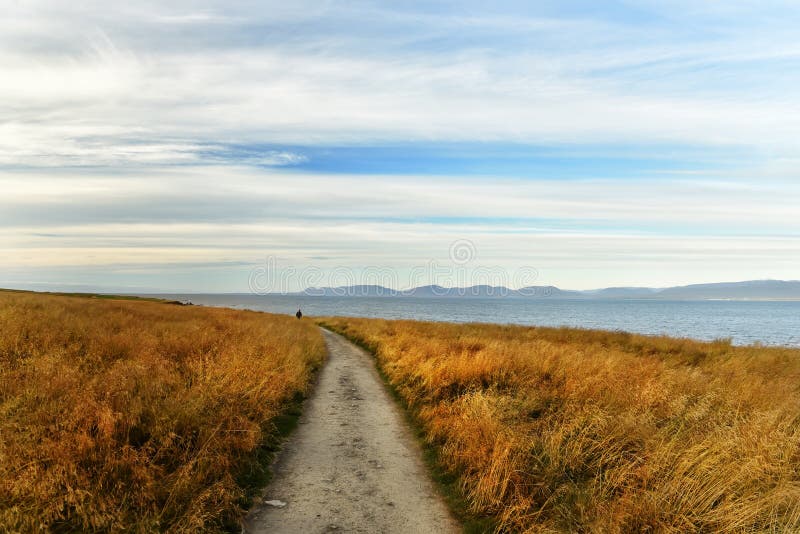 A Path through the Field Overlooking the Ocean Coast and Mountainous ...