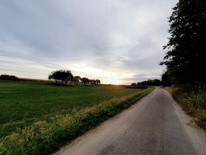 A Path in a Grass Field Leading To the Sunrise Stock Photo - Image of ...