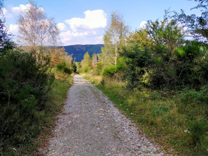 Path on Hill with View of Mountain Stock Image - Image of soil, grass ...
