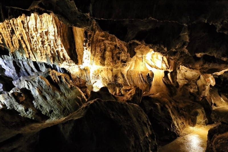 Path Inside Cave with Stone Ornaments and Cracked Walls Stock Photo ...