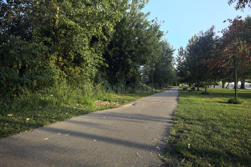 Path in an Isthmus of a Park by the Lakeshore at Sunset Stock Image ...