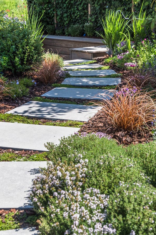 Path with Large Stone Slabs through a Beautifully Planted Garden Stock ...