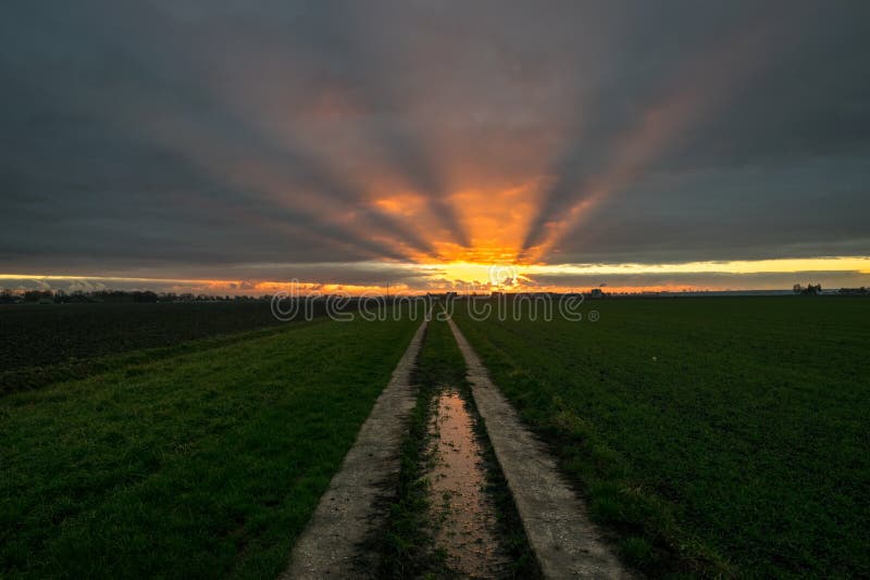 Sunbeams Shine at the Bottom of the Clouds after Sunset. a Path is ...