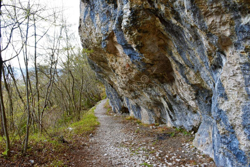 Path Leading Under a Rock Wall Stock Image - Image of trail, stone ...
