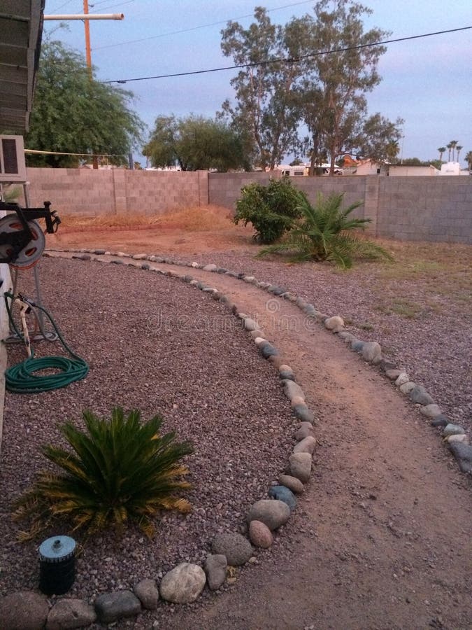 Path Lined with River Rocks in Arizona Backyard Stock Photo - Image of ...