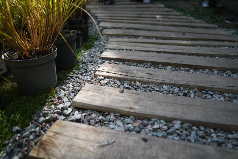 The Path is Lined with Wooden Boards and Decorative Stone Stock Photo ...