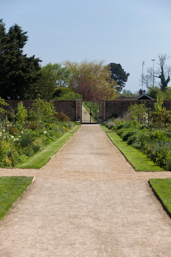 Path in a lush garden stock image. Image of pathway, design - 30960907