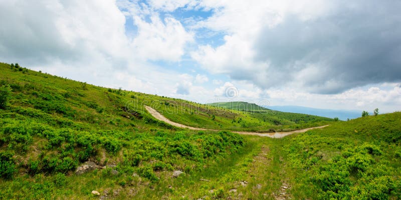 Path through Mountain Landscape. Road through Green Rolling Hills Stock ...