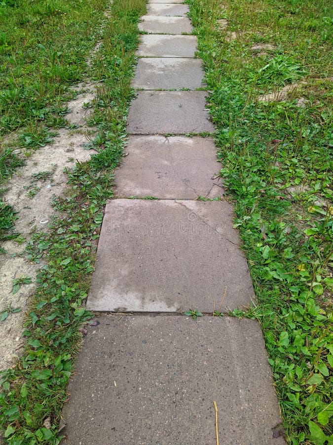 Path in the Park is Made of Concrete Square Slabs. Stock Image - Image ...