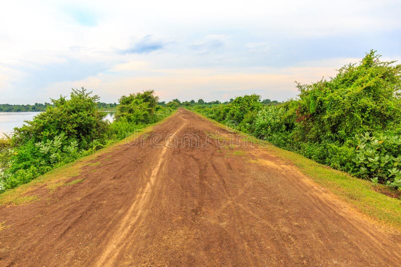 Path on a Quiet Dirt Road Under Cloudy Sky Stock Photo - Image of calm ...