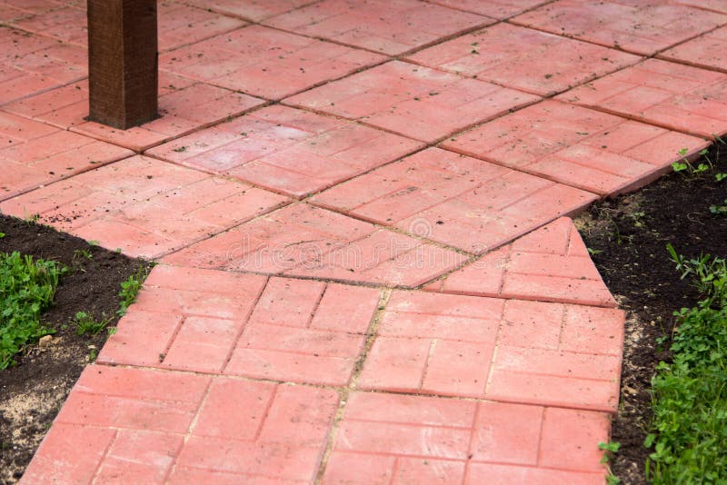 Path of Red Concrete Tiles among Ground Stock Image - Image of material ...